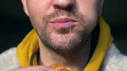 portrait of angry man eating hamburger a... | Stock Video | Pond5