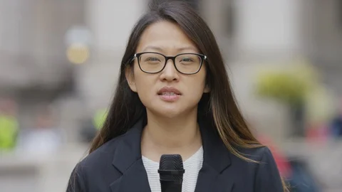 Portrait of Asian female journalist repo... | Stock Video | Pond5