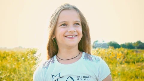 Portrait of attractive little girl with ... | Stock Video | Pond5