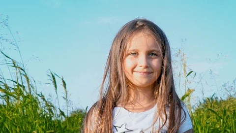 Portrait of attractive little girl with ... | Stock Video | Pond5