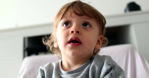 Portrait baby boy hypnotized by screen, ... | Stock Video | Pond5