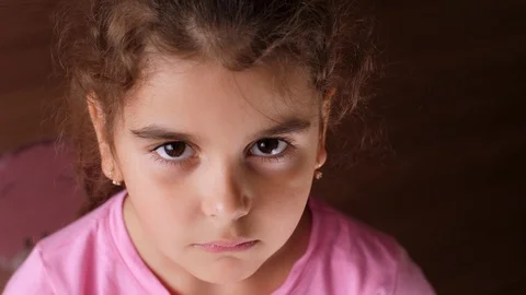 Portrait of a baby girl with a toothless... | Stock Video | Pond5