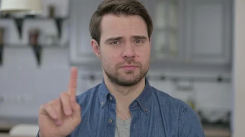 Portrait of Beard Young Man saying No by... | Stock Video | Pond5