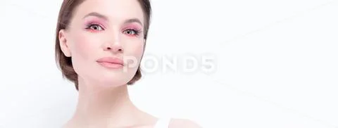 Portrait of a beautiful girl with provocative makeup. White background ...