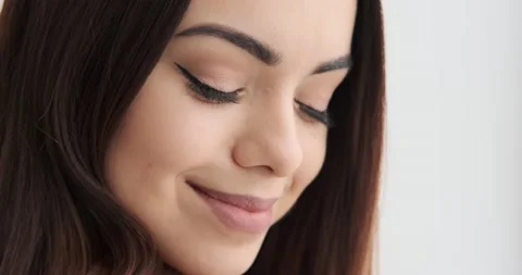 Portrait of beautiful woman winking eye | Stock Video | Pond5