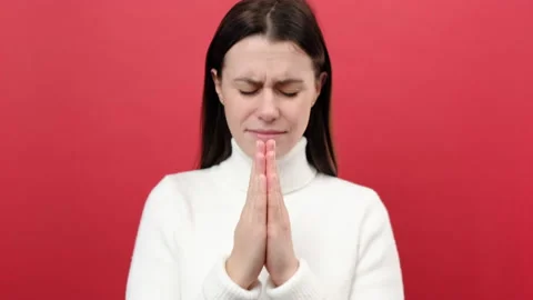 Portrait of beseeching lady holds hands ... | Stock Video | Pond5