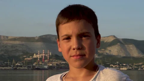 Portrait of a boy on a background of mou... | Stock Video | Pond5