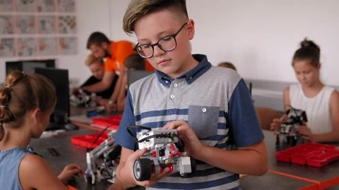 Portrait of a boy student in robotics of... | Stock Video | Pond5