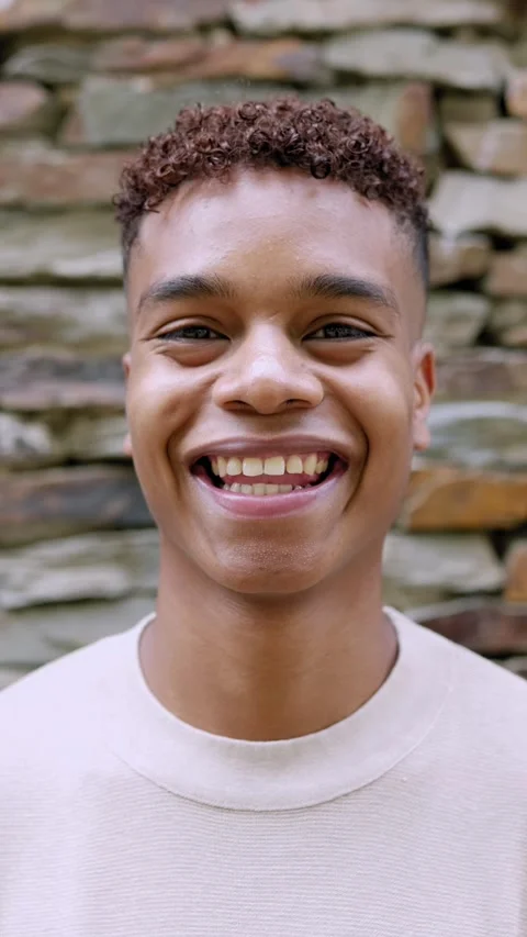 Portrait of cheerful young man raising h... | Stock Video | Pond5