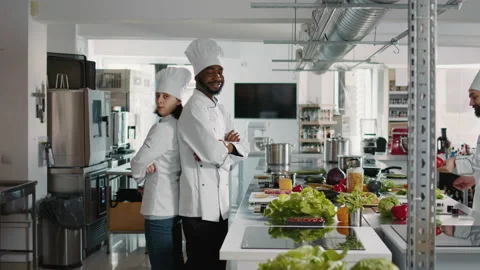 Portrait of chefs doing teamwork to cook... | Stock Video | Pond5