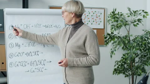 Portrait of confident lady teaching Chem... | Stock Video | Pond5