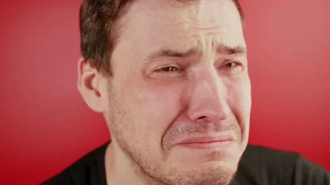 Portrait of a crying man on a red backgr... | Stock Video | Pond5