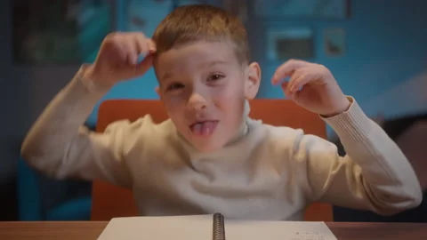 Portrait of cute boy kid smiling, making... | Stock Video | Pond5