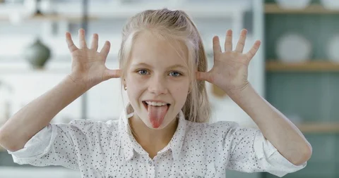 Portrait of cute Caucasian girl doing si... | Stock Video | Pond5