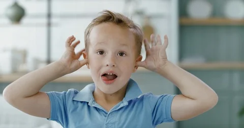 Portrait of cute Caucasian kid boy doing... | Stock Video | Pond5