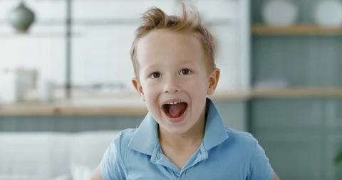 Portrait of cute Caucasian kid boy doing... | Stock Video | Pond5