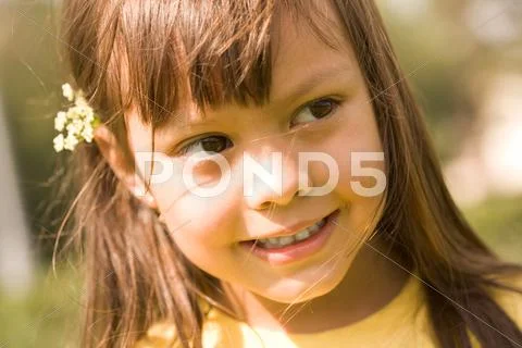 Portrait of cute girl looking aside and smiling ~ Hi Res #21288713