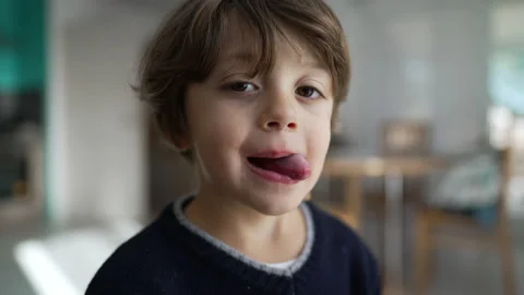 Portrait of a cute little boy sticking t... | Stock Video | Pond5