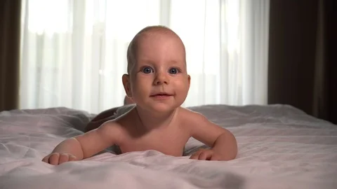 Portrait. Cute Little Happy Baby boy lay... | Stock Video | Pond5