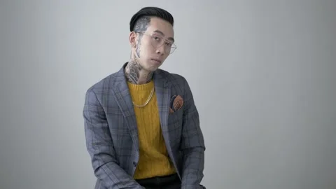 Portrait of dapper young man with tattoo... | Stock Video | Pond5