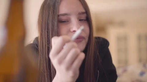 Portrait of a drug addicted woman smokin... | Stock Video | Pond5