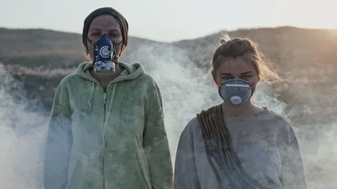 Portrait of exhausted girls in gas mask ... | Stock Video | Pond5