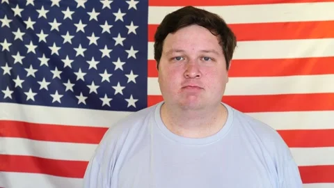 Portrait of fat man in front of the Amer... | Stock Video | Pond5