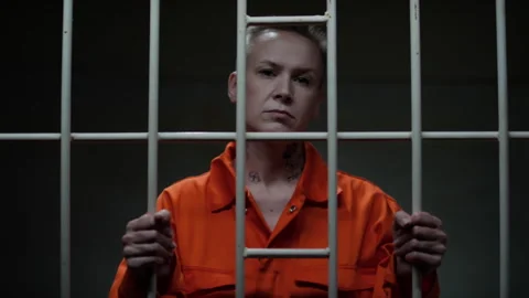 Portrait of Female Inmate behind Bars in... | Stock Video | Pond5