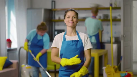 Portrait of female janitor in uniform sm... | Stock Video | Pond5