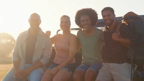 Portrait Of Friends Sitting On Tailgate ... | Stock Video | Pond5