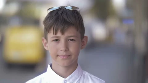 portrait of a funny boy looking at the c... | Stock Video | Pond5