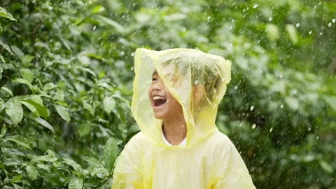 Portrait of Funny boy wears raincoat in ... | Stock Video | Pond5