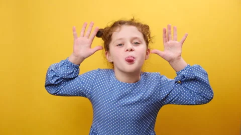 Portrait of funny girl child sticking ou... | Stock Video | Pond5