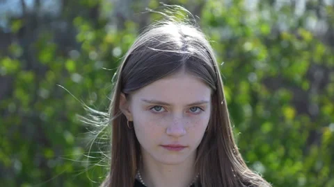 Portrait of a gloomy pouting cute girl w... | Stock Video | Pond5