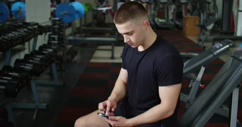 Portrait of guy in gym while resting bet... | Stock Video | Pond5