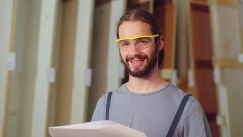 Portrait of handsome craftsman looking t... | Stock Video | Pond5