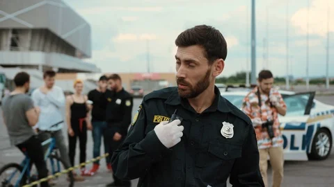 Portrait of handsome police officer on d... | Stock Video | Pond5