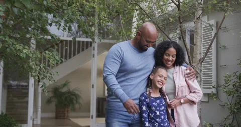 Portrait of happy biracial parents with ... | Stock Video | Pond5