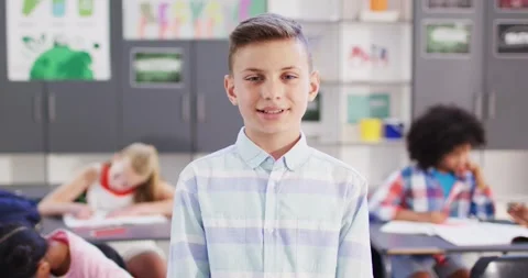 Portrait of happy caucasian schoolboy at... | Stock Video | Pond5