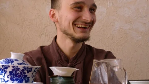 Portrait happy man laughing on tea cerem... | Stock Video | Pond5