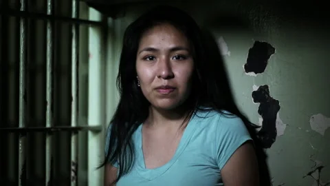 Portrait of Hispanic woman in dark jail ... | Stock Video | Pond5