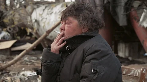 Portrait homeless woman smoking a cigare... | Stock Video | Pond5