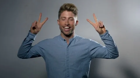 Portrait of a Male Model: Peace Signs | Stock Video | Pond5