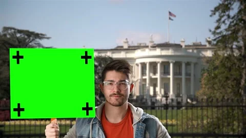 Portrait of man holding a green screen, ... | Stock Video | Pond5