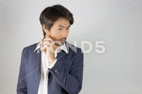 Portrait Man in Navy Blue Suit Looking Below and Touch Chin Pose Stock ...