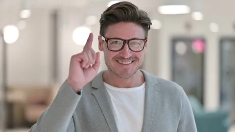 Portrait of Middle Aged Man Pointing Fin... | Stock Video | Pond5