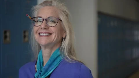 Portrait of a Middle-Aged Teacher in a S... | Stock Video | Pond5