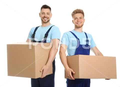 Photograph: Portrait of moving service employees with cardboard boxes ...