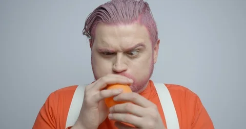 Portrait of the pink head man blowing up... | Stock Video | Pond5