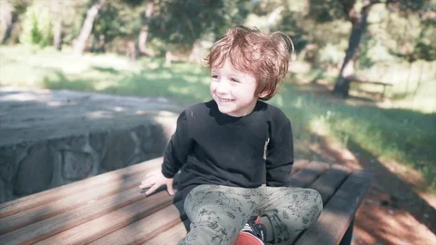 Portrait of preschool cute kid in nature... | Stock Video | Pond5